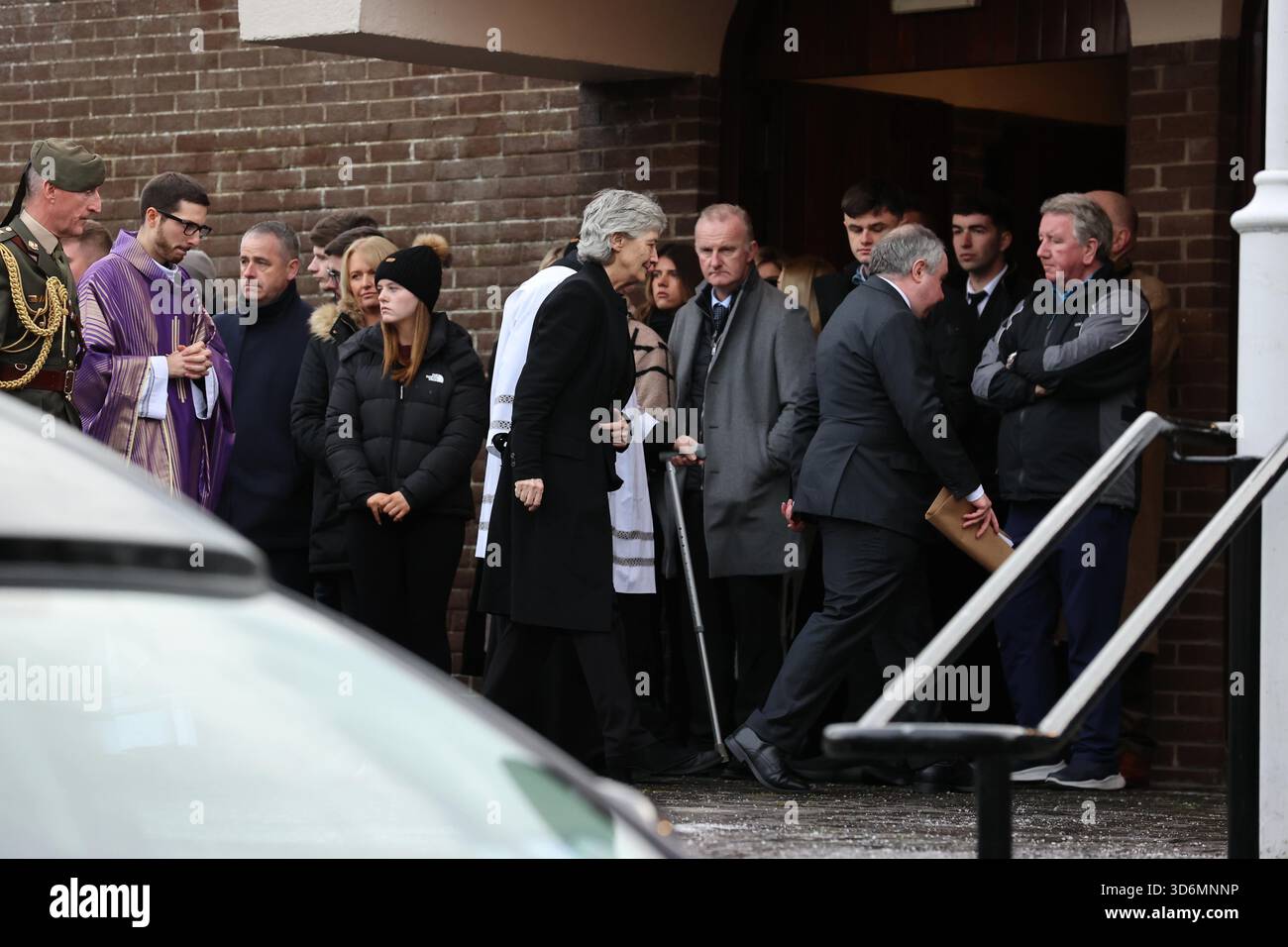 Irish President Catherine Connolly arrives for the funeral service of Dylan Commins, 23, from ...