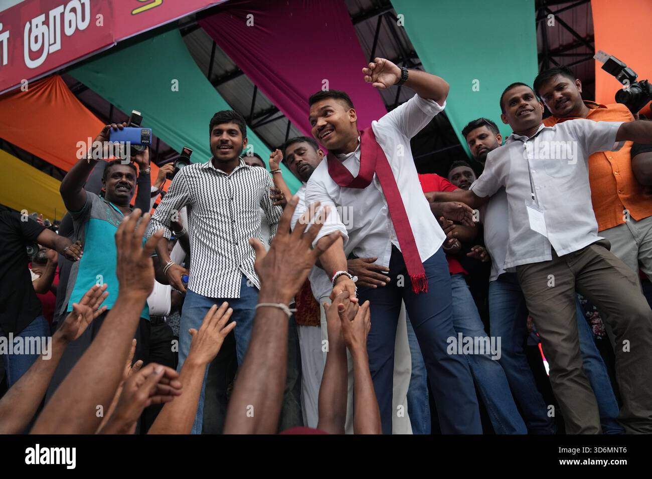 Sri Lankan lawmaker Namal Rajapaksa, heir to the once-powerful Rajapaksa dynasty, waves to ...