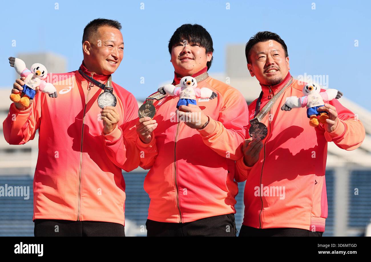 (L-R) silver medalist Masatoshi Morimoto, gold medalist Riki Toyama ...