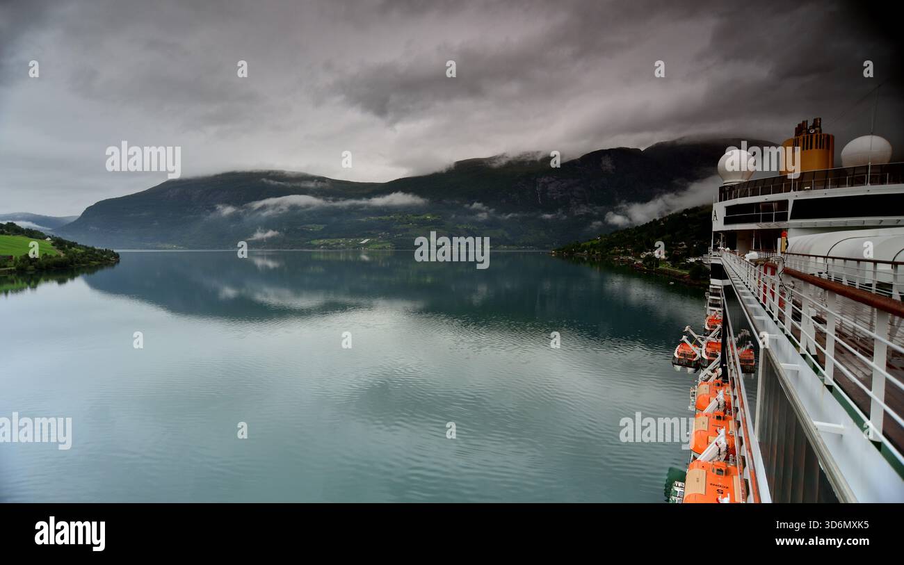 A wet day in Olden at the end of the Nordfjord, Western Norway, seen ...