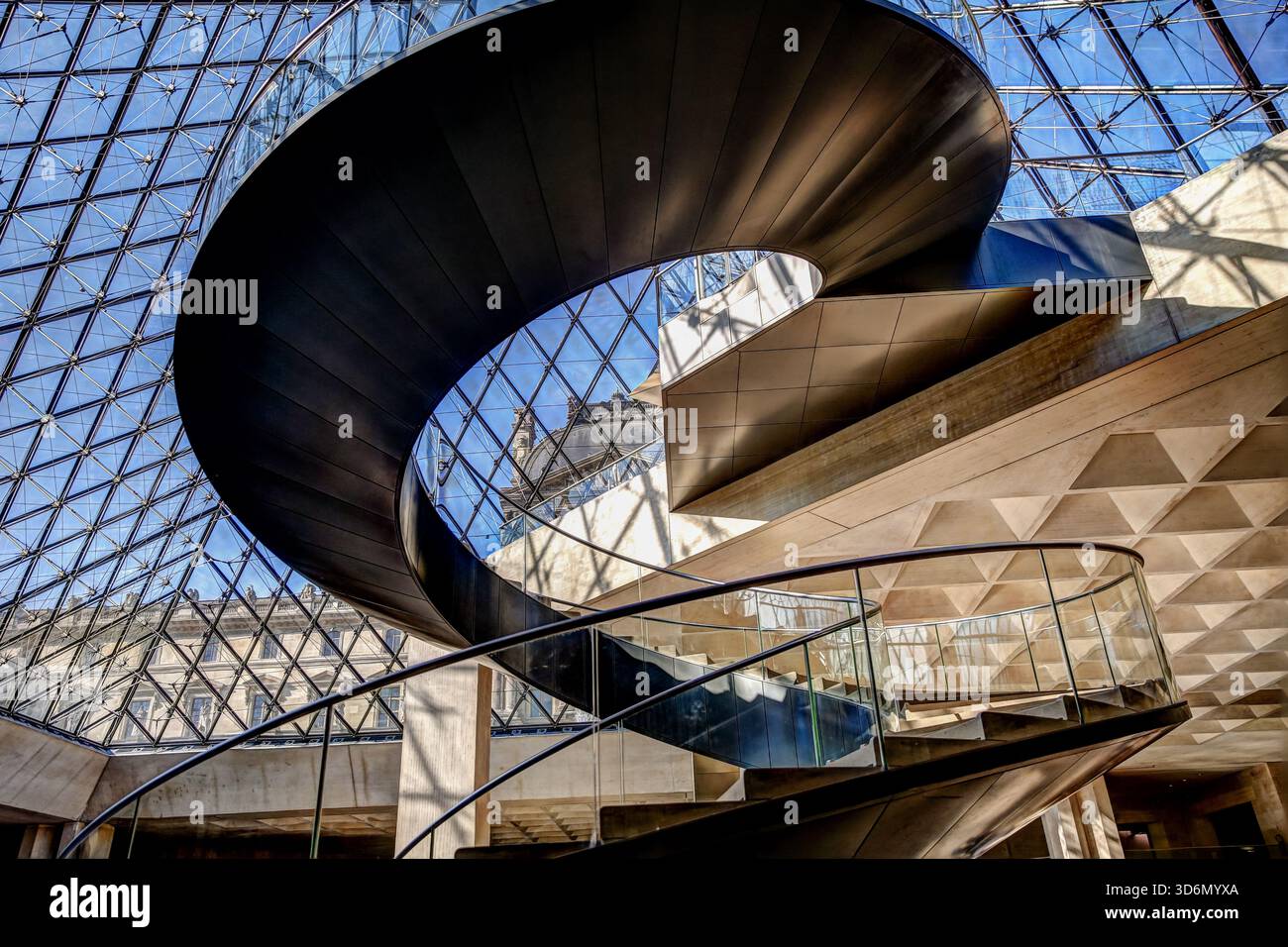 The Louvre’s Inverted Pyramid and spiral staircase in Paris Stock Photo ...