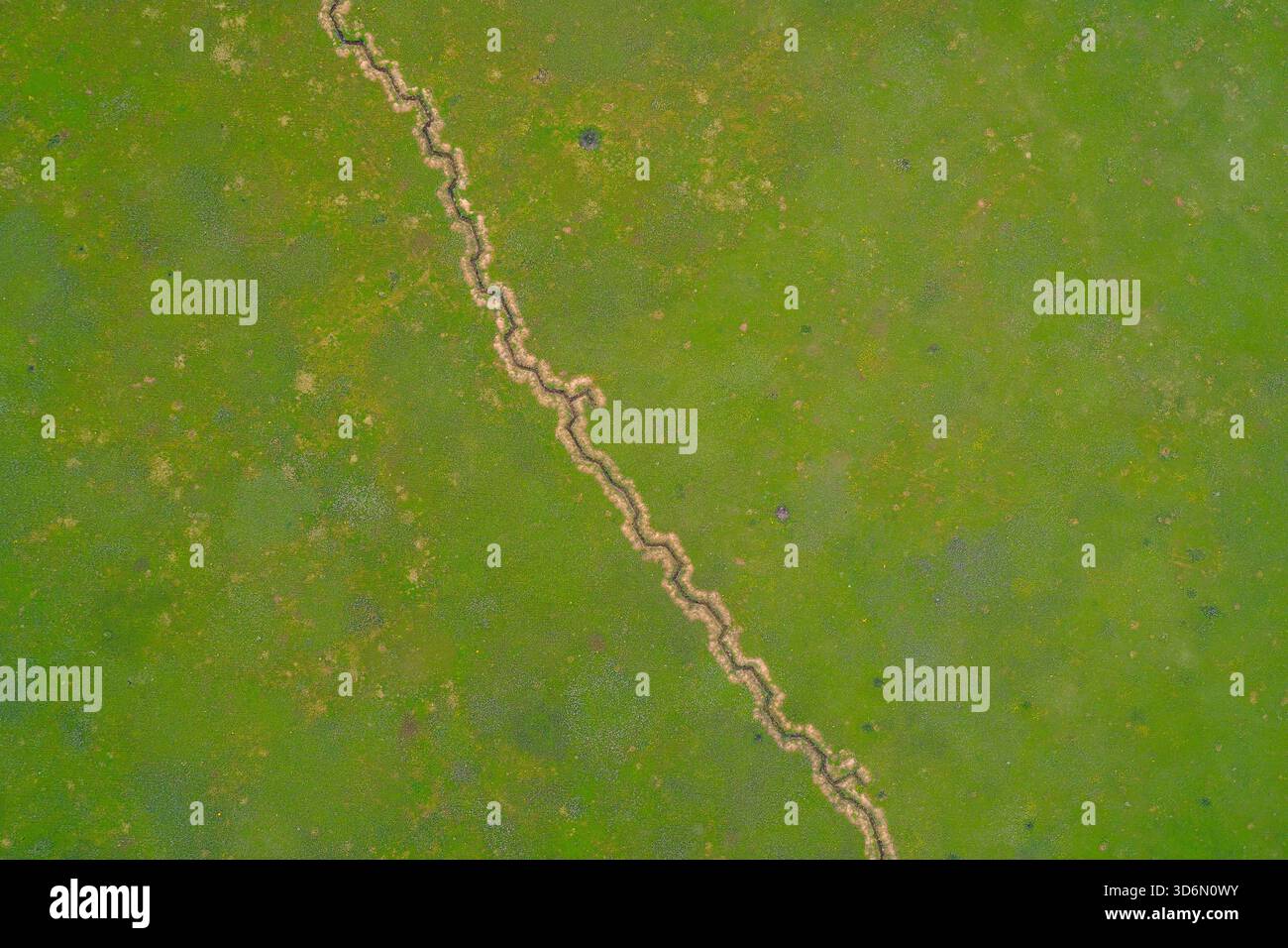 Top-down aerial photo capturing a defensive military trench line on ...