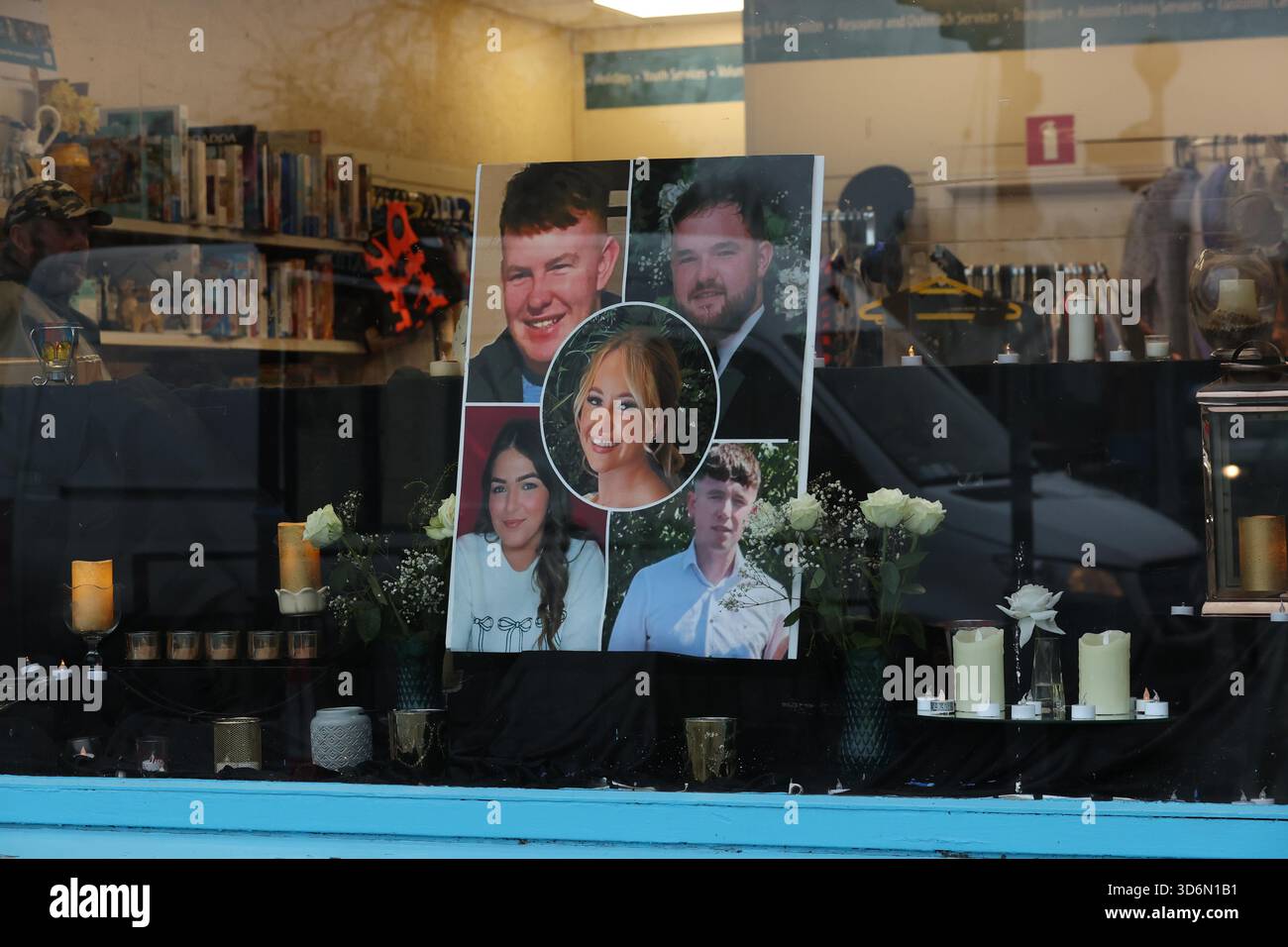 A shop displays a picture of five friends who died in a car crash at the weekend, during the ...