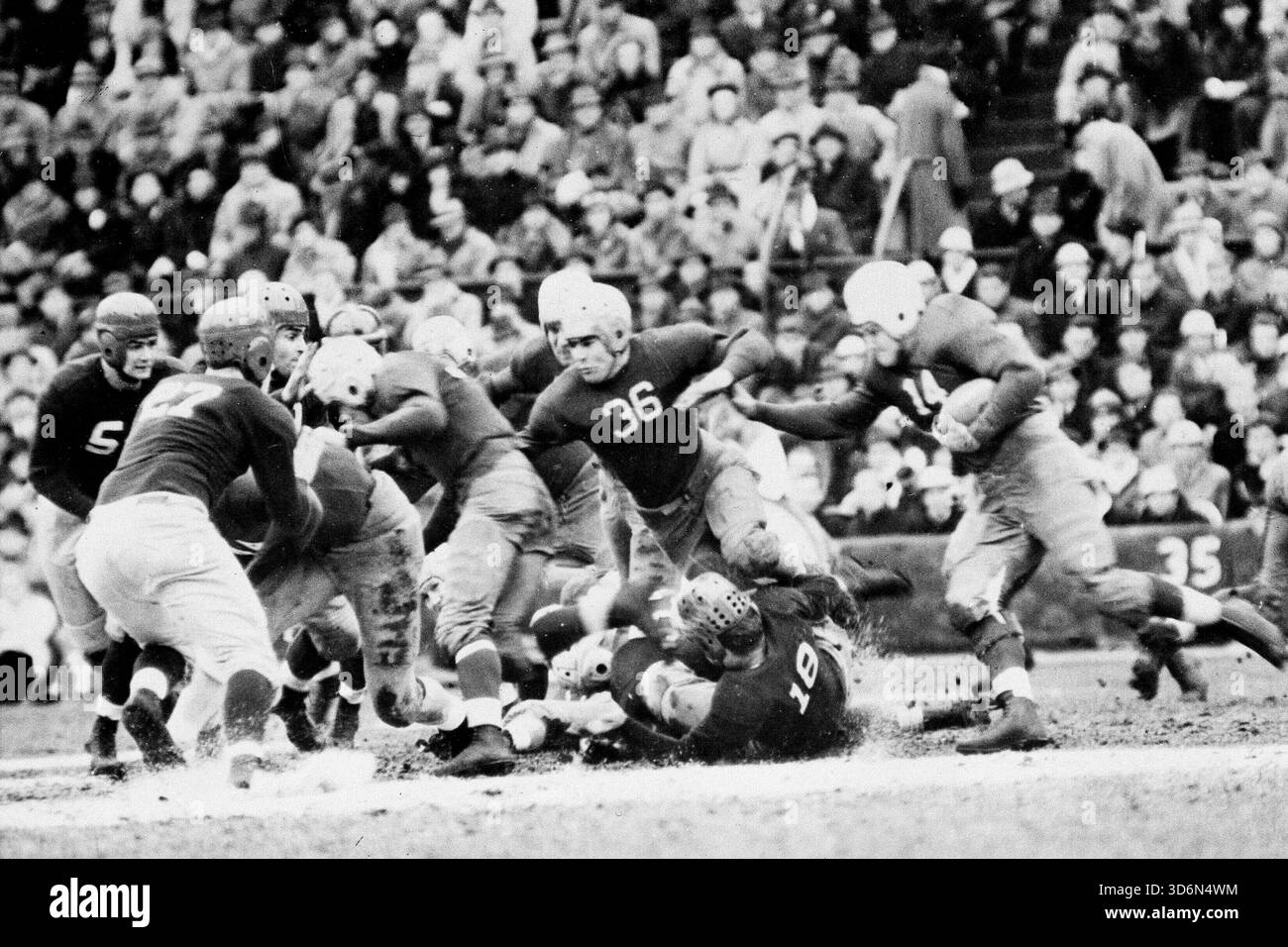 FILE - Team captain, Clint Frank (14) of Yale, swings around the end ...