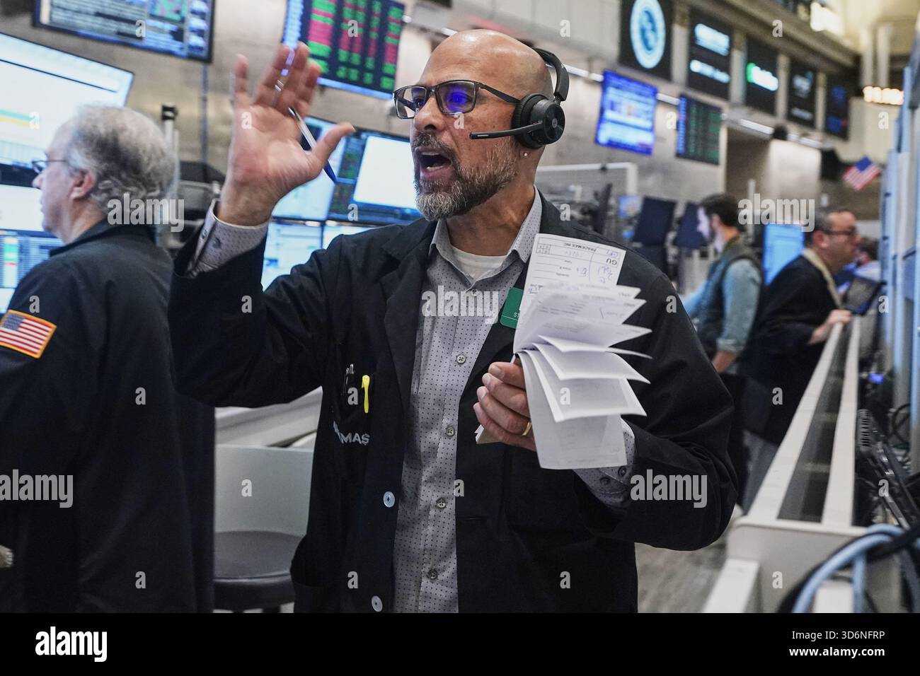 Options trader Steven Rodriguez works on the floor of the New York ...