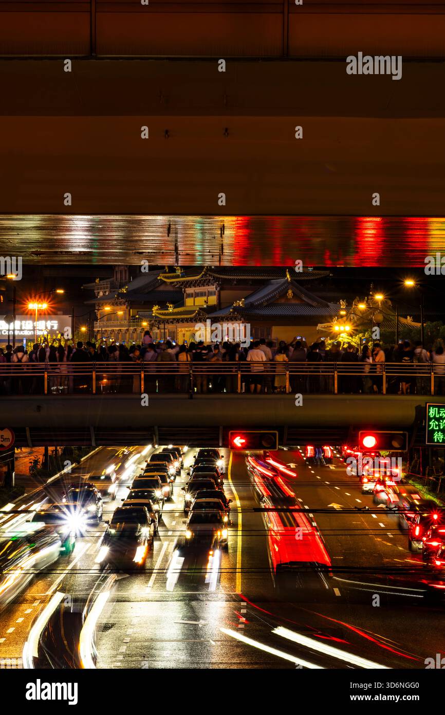 Crowds line a pedestrian overpass bridge during China’s National Day ...
