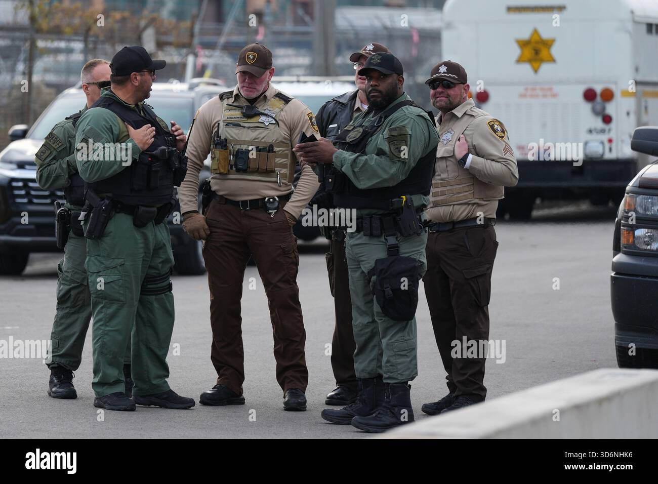 Law enforcement officers guard outside an ICE processing facility in the Chicago suburb of ...