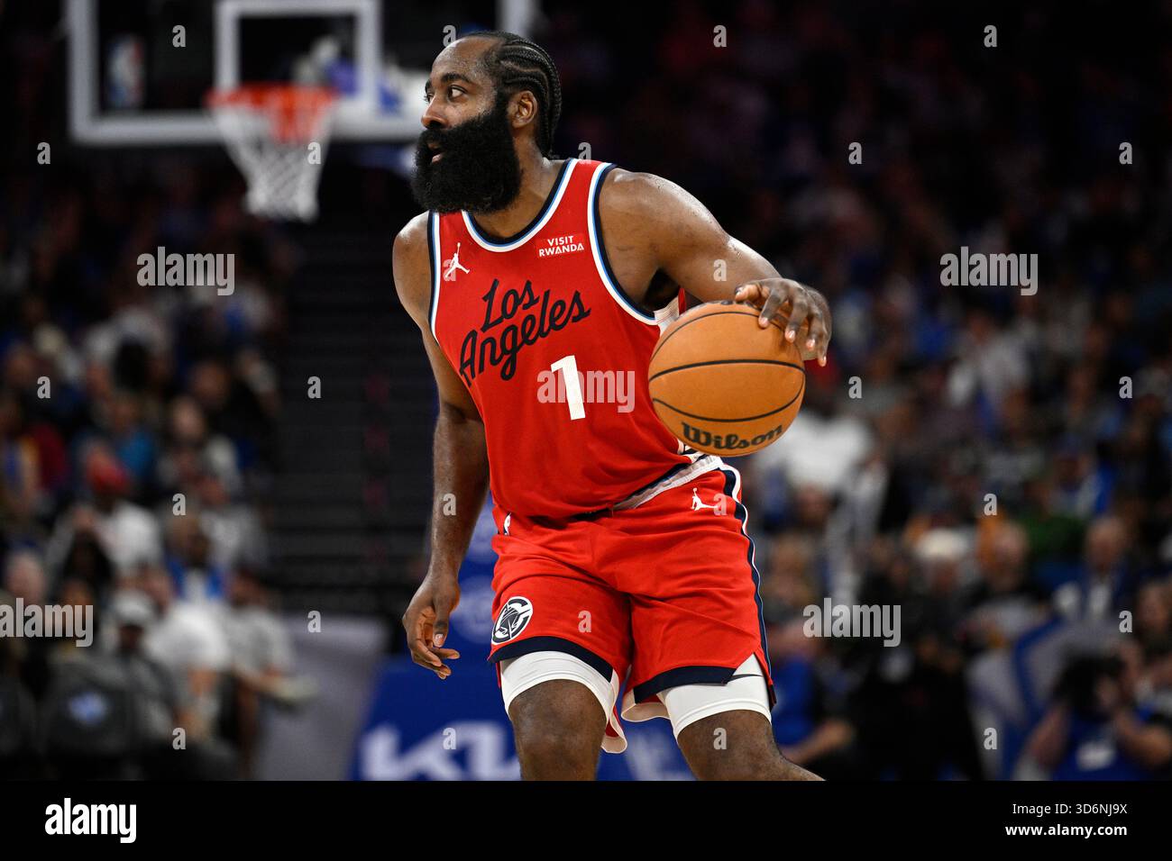 Los Angeles Clippers guard James Harden (1) drives to the basket during ...
