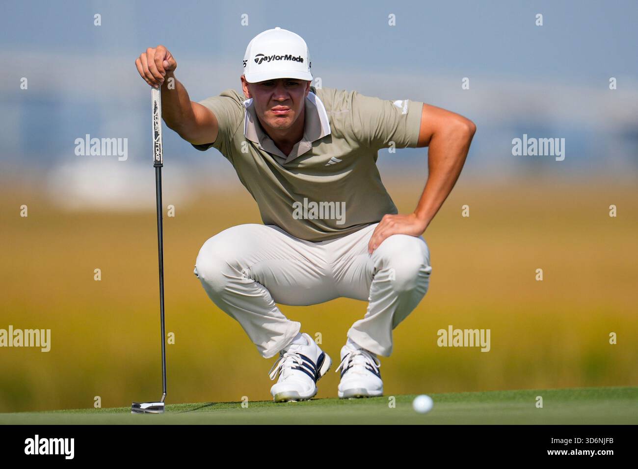 Michael Thorbjornsen lines up a putt on the 14th fairway during the ...