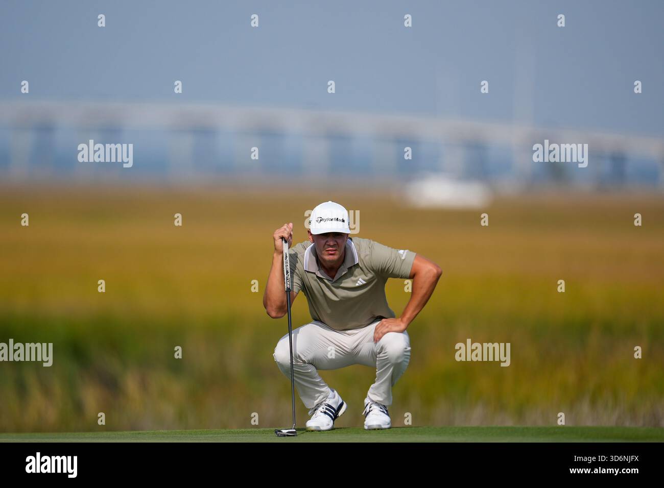 Michael Thorbjornsen lines up a putt on the 14th fairway during the ...