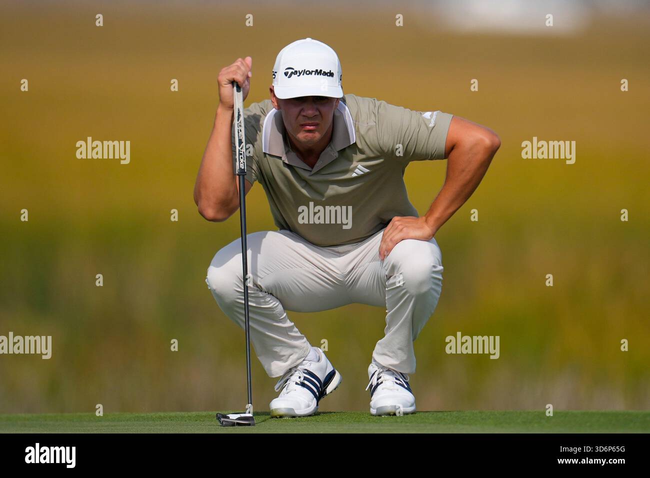 Michael Thorbjornsen lines up a putt on the 14th green during the ...
