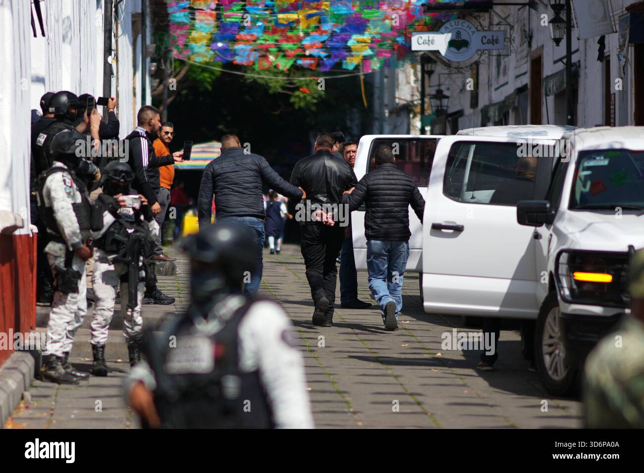 Michoacan state prosecutor officers detain a suspect in the killing of ...