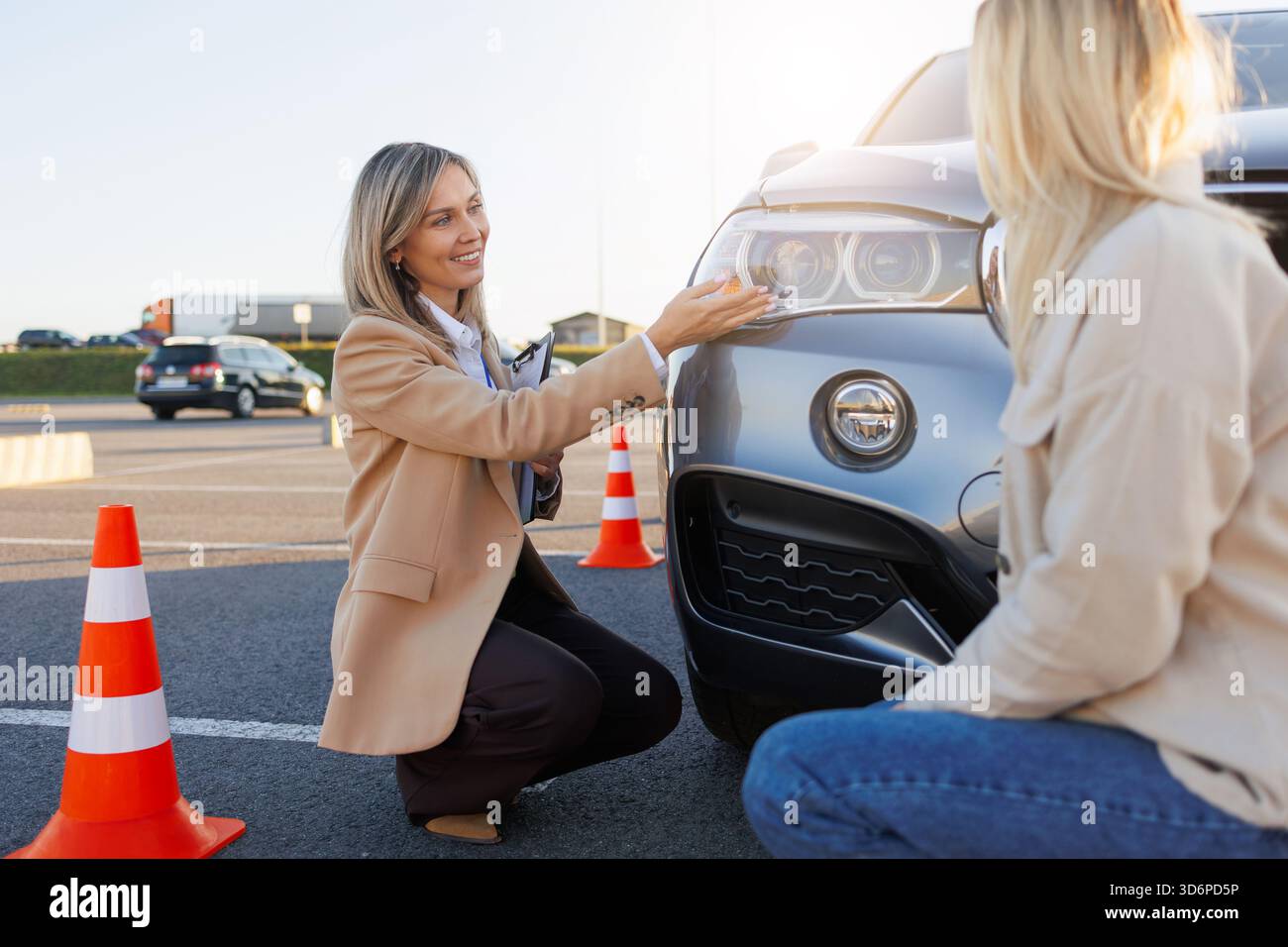 Driving Instructor Demonstrating Vehicle Lights to New Driver Stock ...