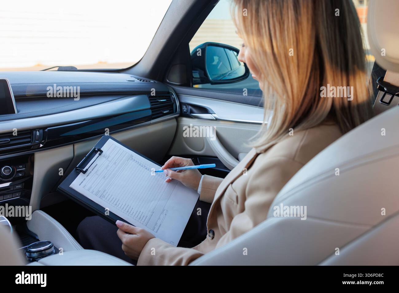 Driving Examiner Reviewing Notes During Practical Driving Test Stock ...