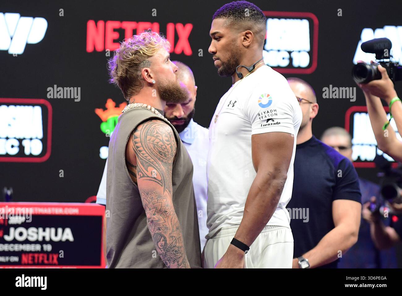 Jake Paul and Anthony Joshua face each other during the press ...