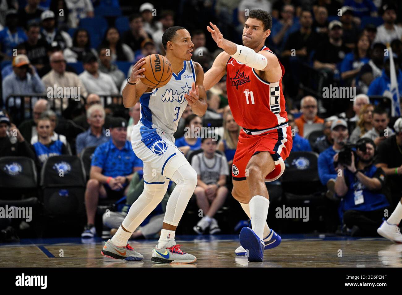 Orlando Magic guard Desmond Bane (3) is defended by Los Angeles ...