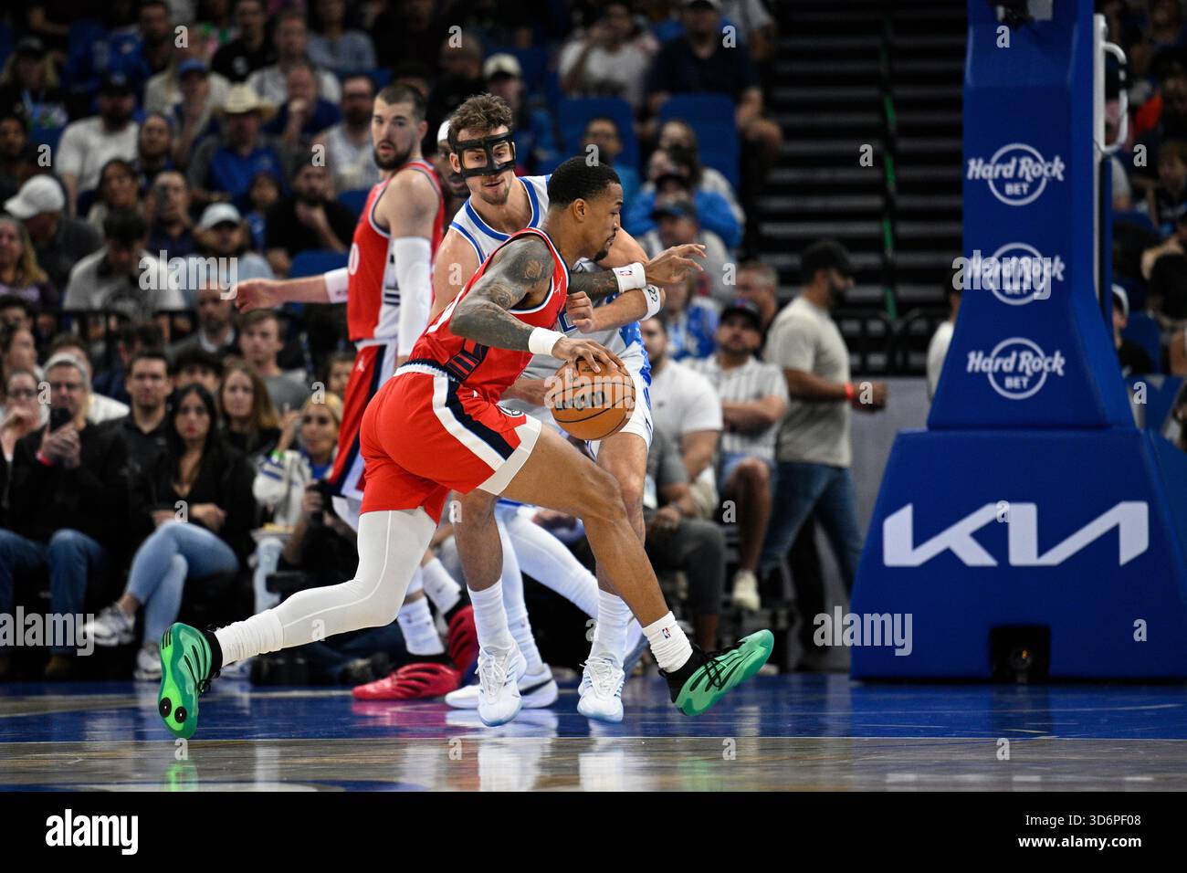 Los Angeles Clippers forward John Collins, front, is defended by ...