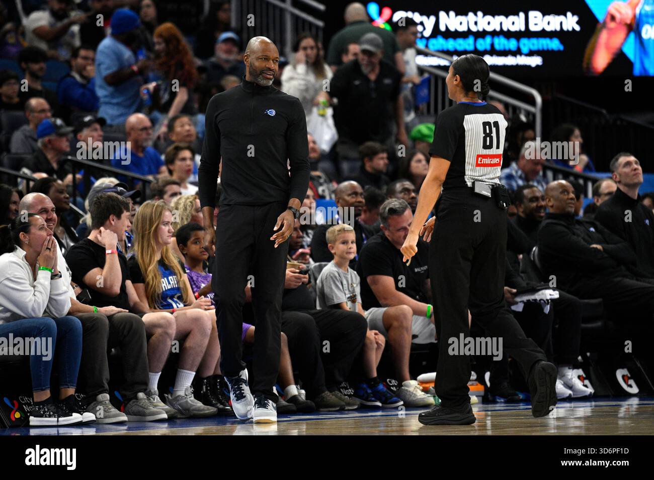 Orlando Magic head coach Jamahl Mosley, left, talks with official ...