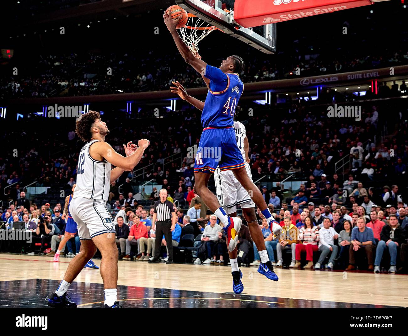 Kansas Jayhawks forward Flory Bidunga (40) on a reverse dunk as Duke defenders try to defend ...