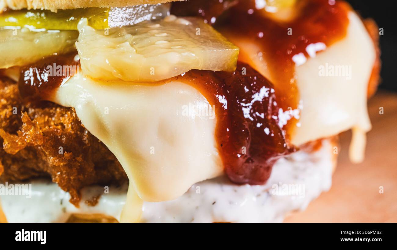 Crispy Korean fried chicken katsu burger with savory sauce in a soft ...
