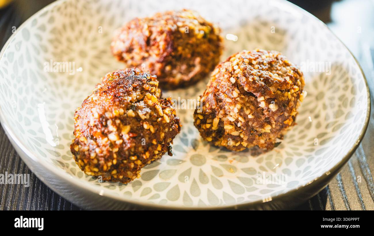 Crispy homemade fried kibbeh served in a rustic bowl, ready to eat ...