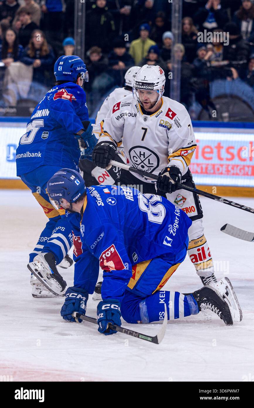 Ramon Tanner #7 (HC Lugano) stands in front of Fabrice Herzog #68 (EV ...