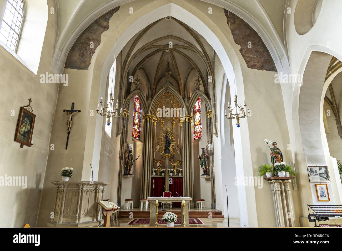 Magnificent church altar with golden details surrounded by Gothic ...