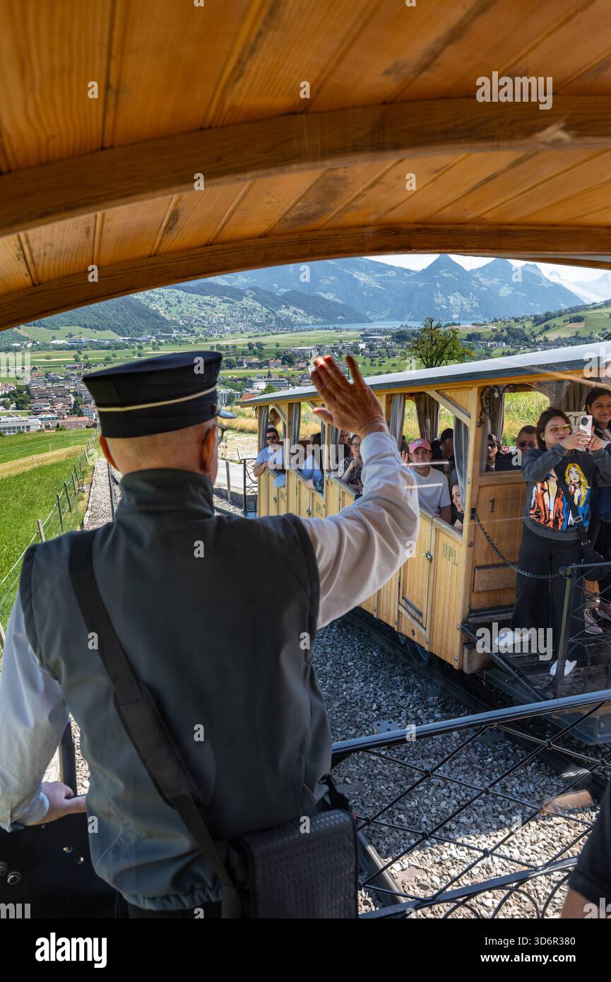 Vintage train conductor waving hi-res stock photography and images - Alamy