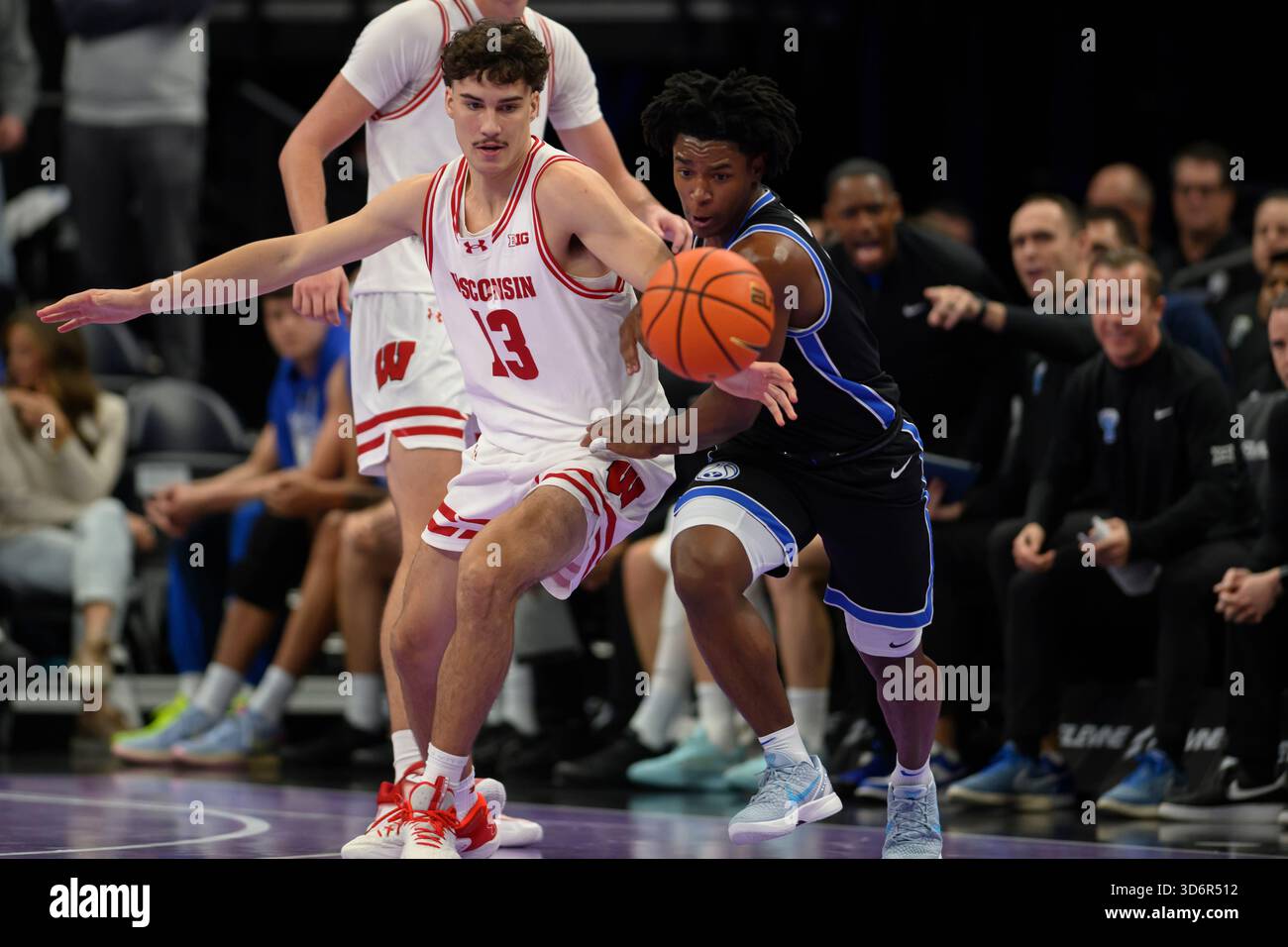 BYU guard Robert Wright III, right, steals the ball from Wisconsin ...