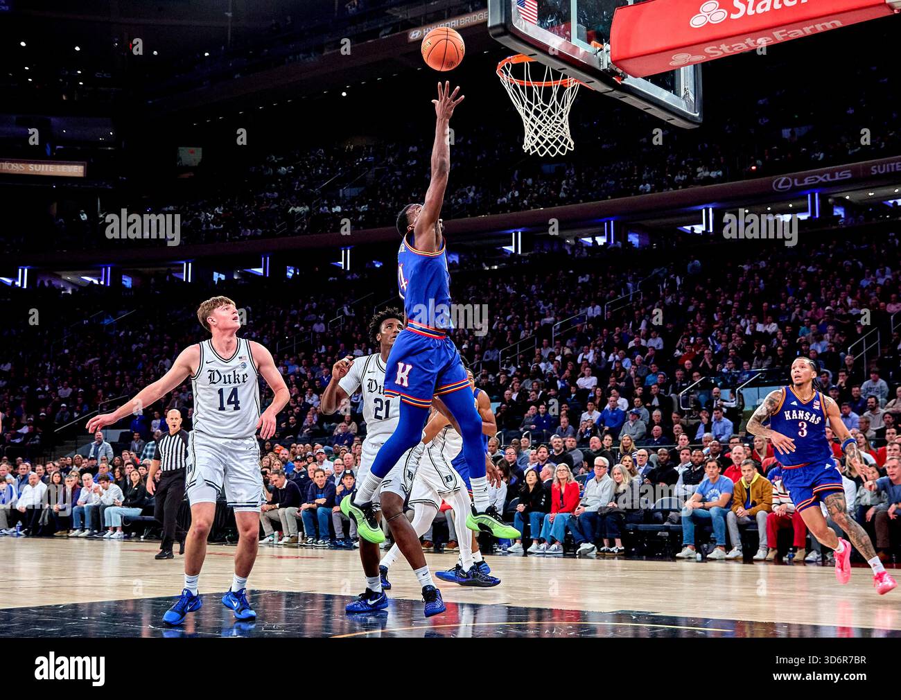 Kansas Jayhawks guard Melvin Council Jr. (14) glides to the basket ...