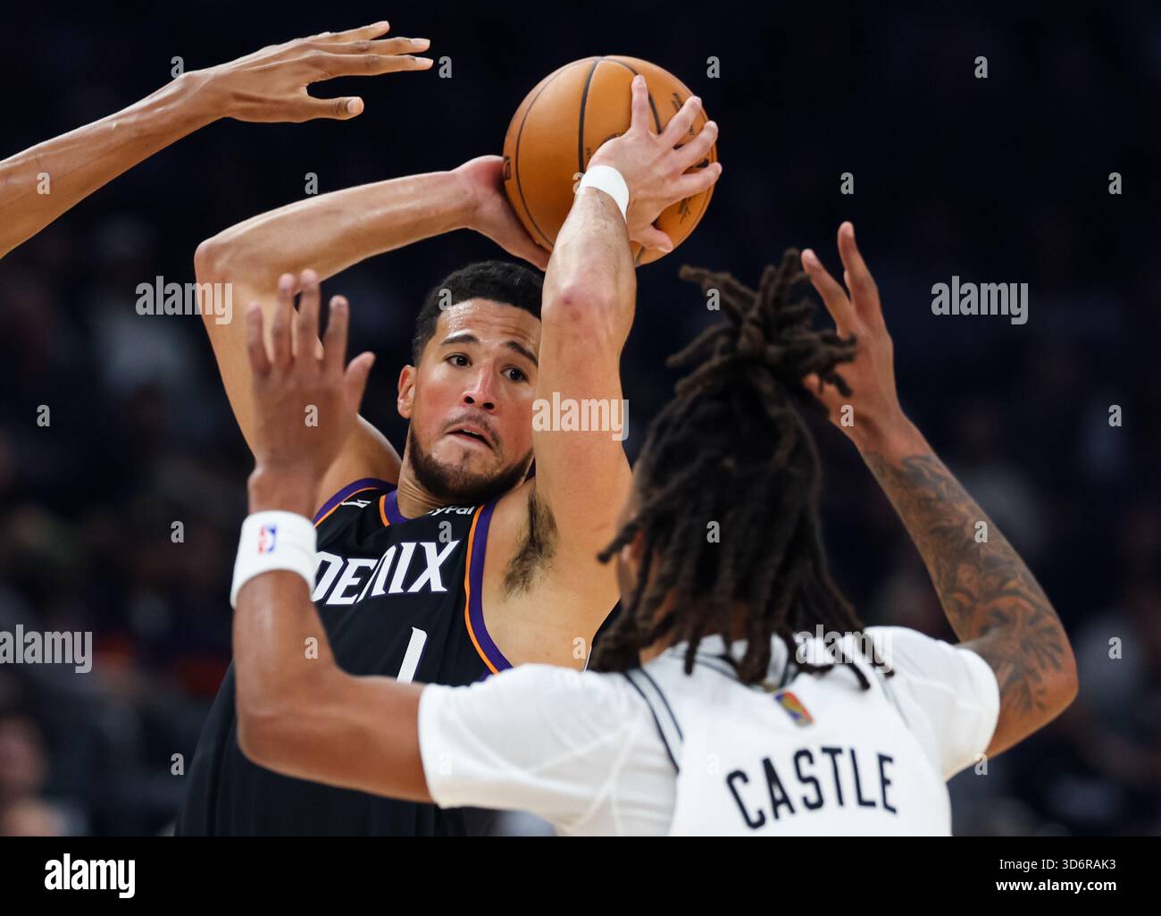Phoenix Suns guard Devin Booker (1) looks to pass during the first half ...