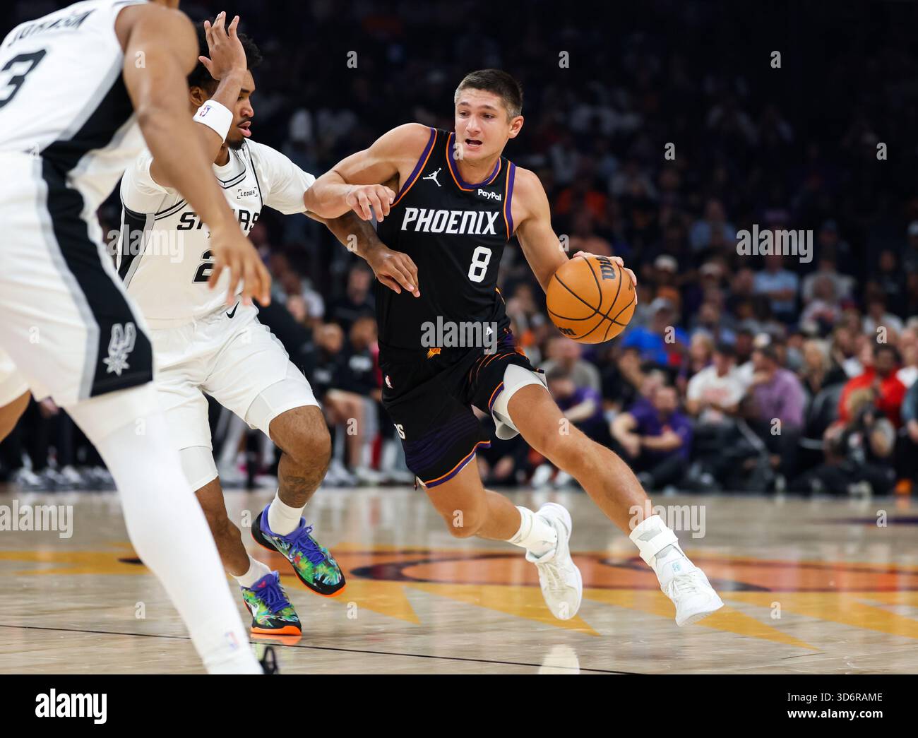 Phoenix Suns guard Grayson Allen (8) looks for room as San Antonio ...