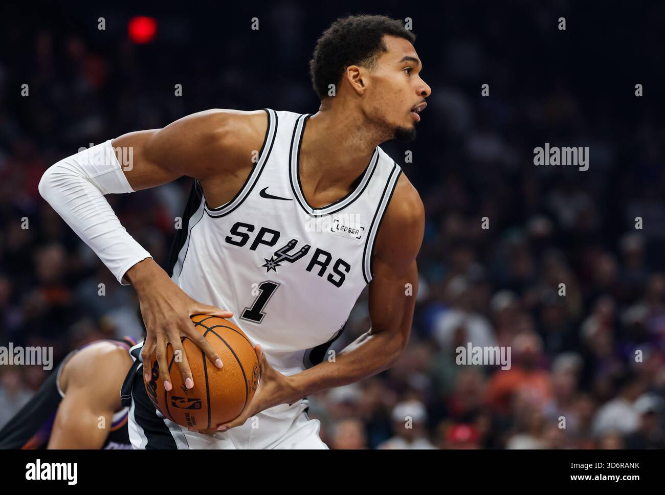San Antonio Spurs forward Victor Wembanyama (1) looks to pass the ball ...