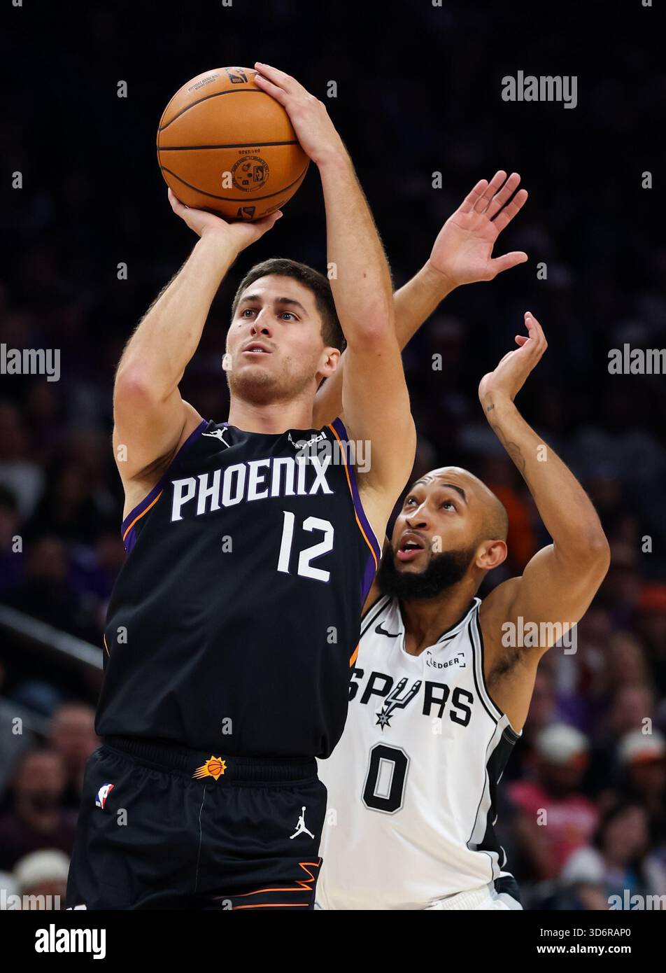 Phoenix Suns guard Collin Gillespie (12) shoots under the defense of ...