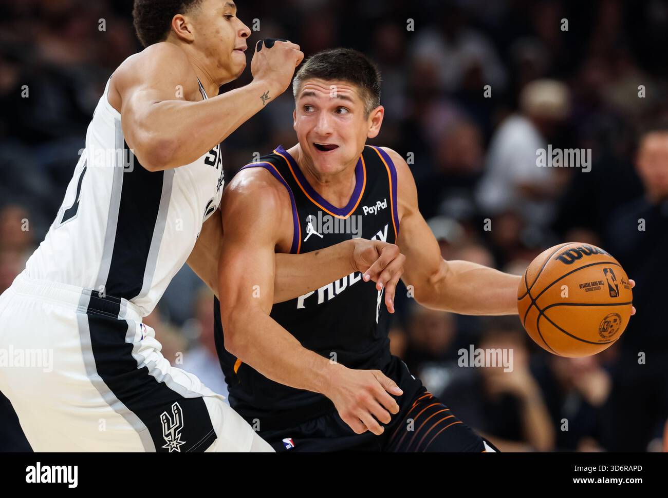 Phoenix Suns guard Grayson Allen (8) dribbles as San Antonio Spurs ...