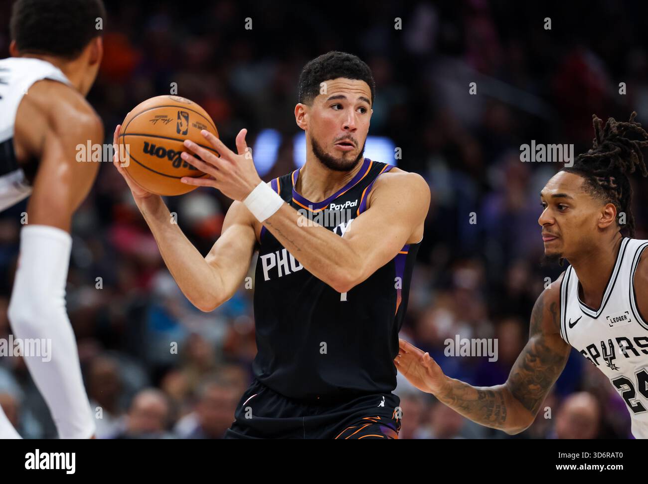 Phoenix Suns guard Devin Booker (1) looks to pass during the first half ...