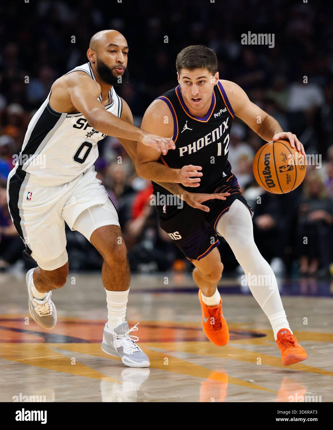 Phoenix Suns guard Collin Gillespie (12) dribbles as San Antonio Spurs ...