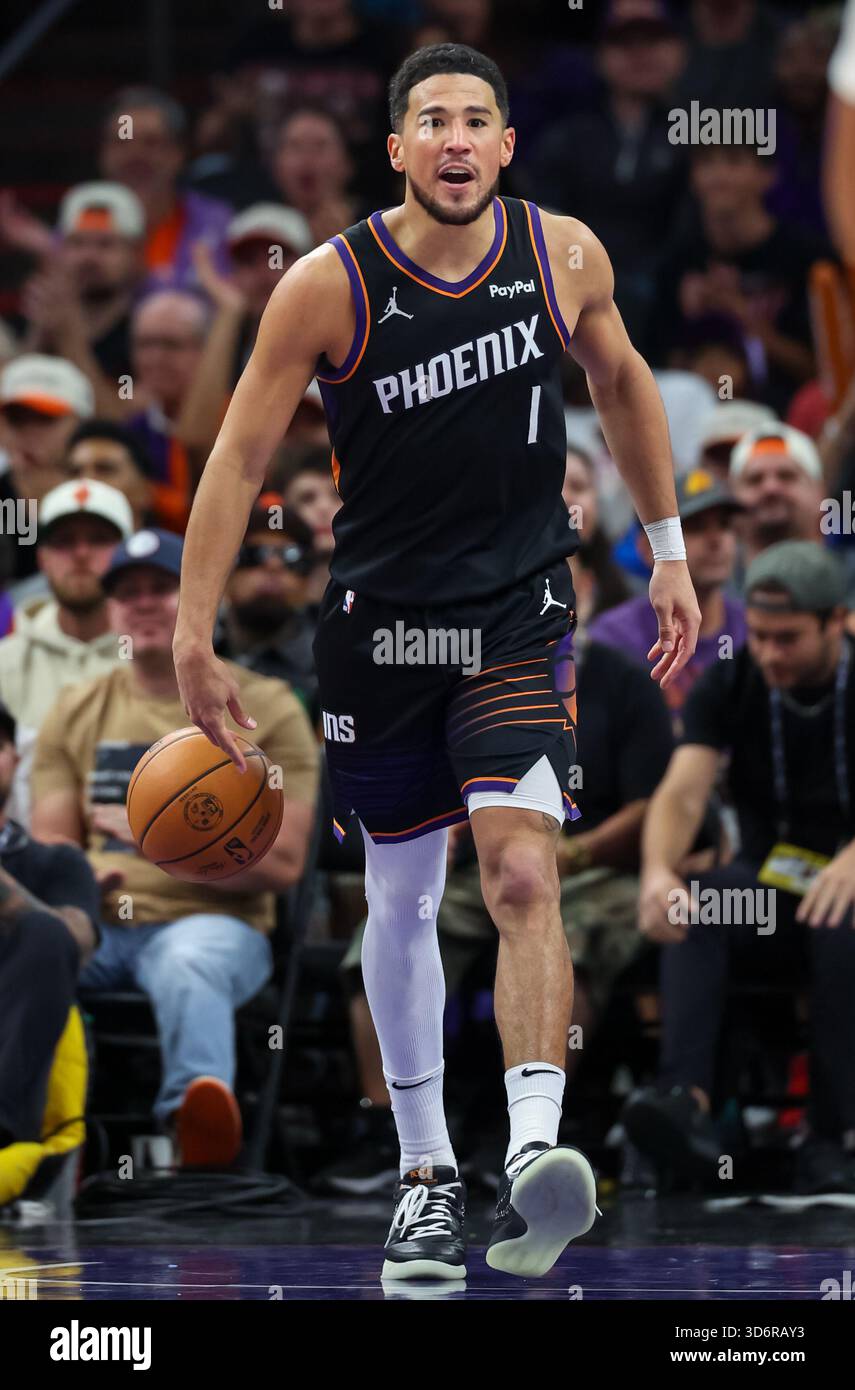 Phoenix Suns guard Devin Booker (1) reacts during the second half of an ...