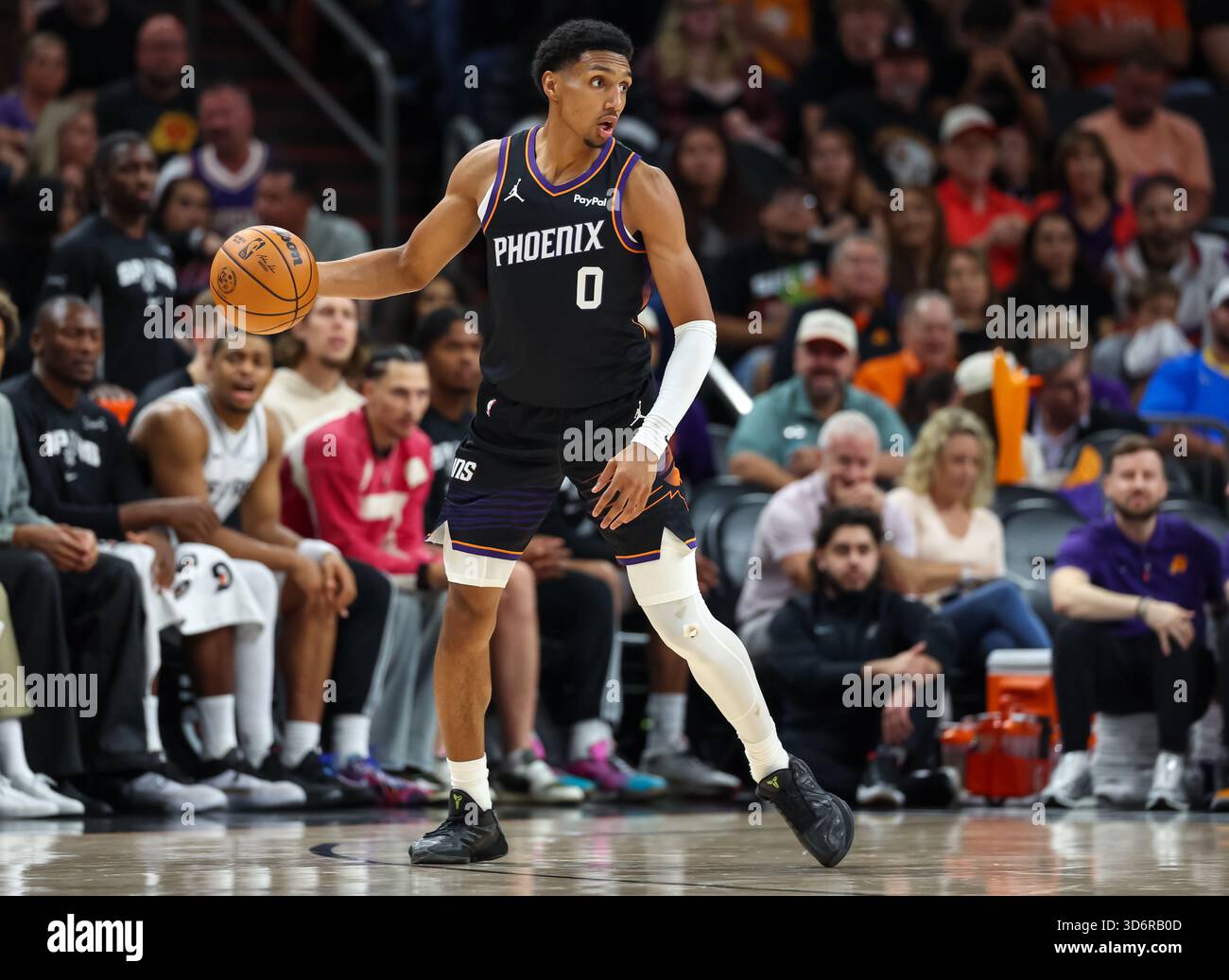 Phoenix Suns forward Ryan Dunn (0) dribbles during the second half of ...