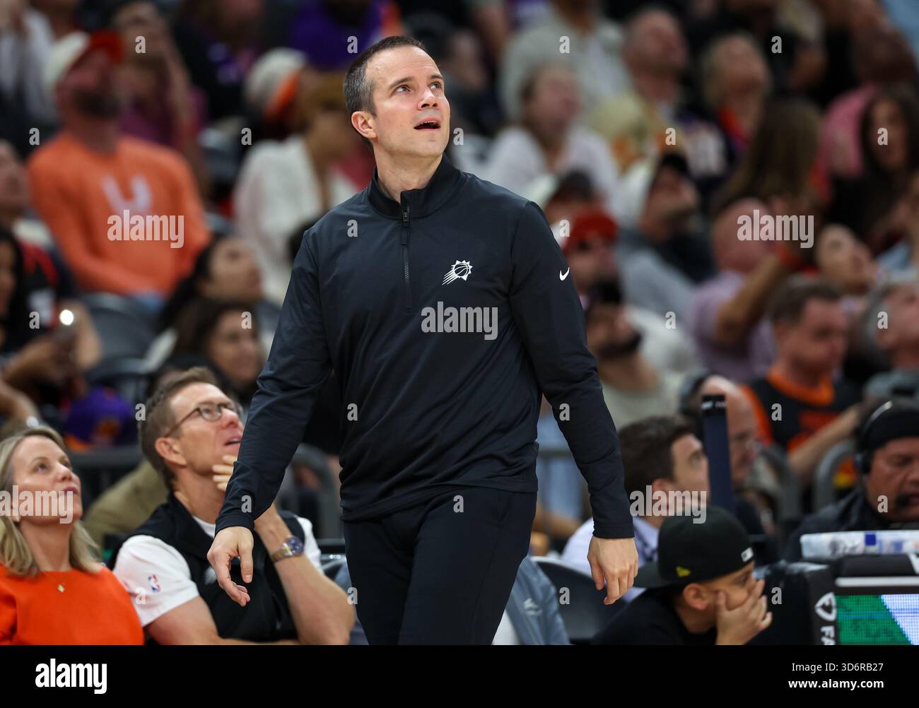 Phoenix Suns head coach Jordan Ott watches a video replay during the ...