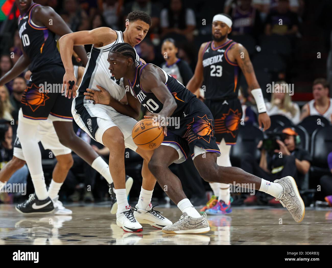 Phoenix Suns forward Rasheer Fleming (20) dribbles as San Antonio Spurs ...