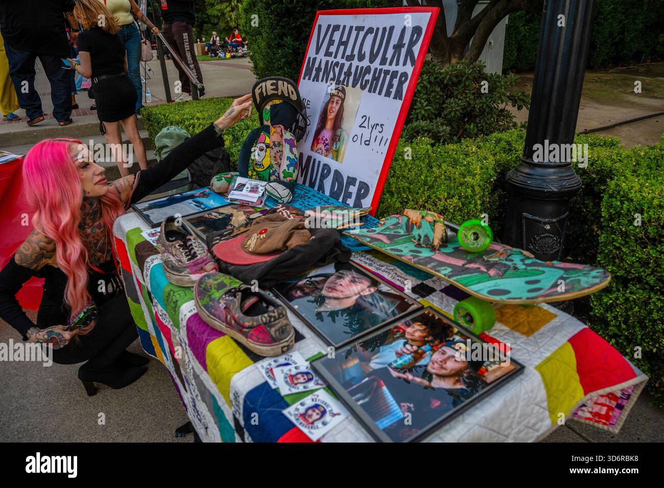 September 25, 2025, Sacramento, Ca: Erika Pringle straightens a hat on ...