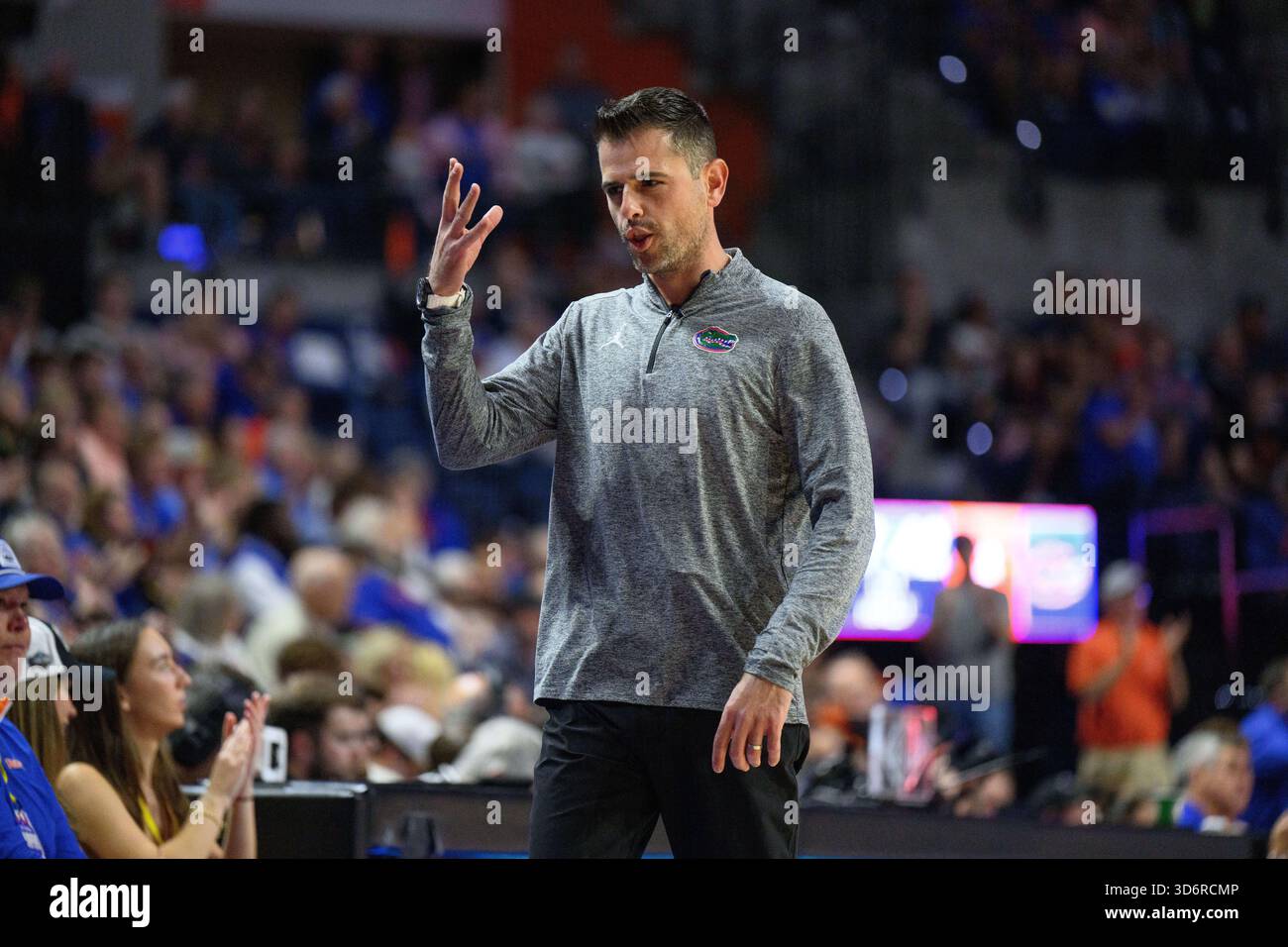 Florida head coach Todd Golden talks to his bench during the first half ...