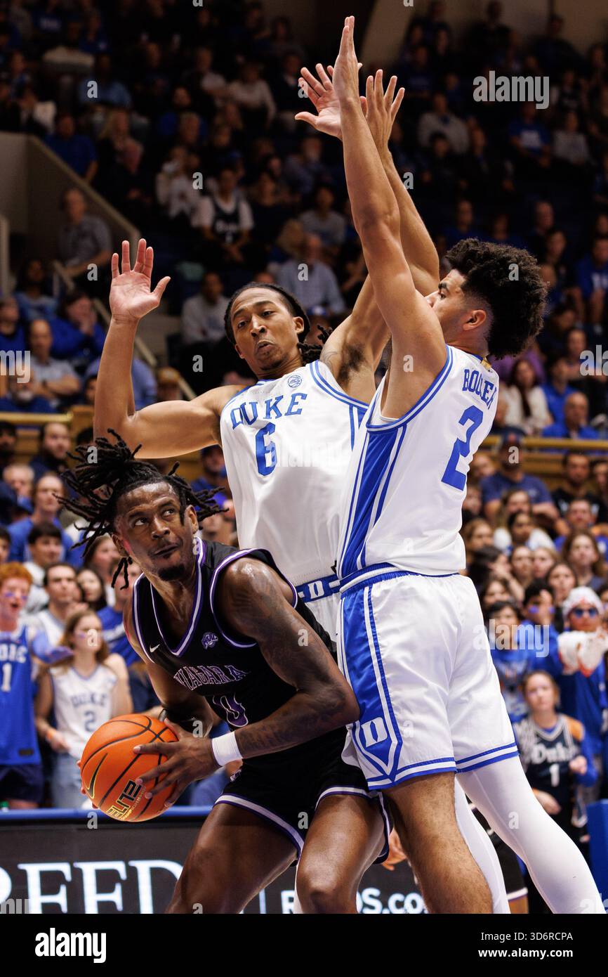 Niagara's Justin Hawkins (0) handles the ball as Duke's Maliq Brown (6 ...