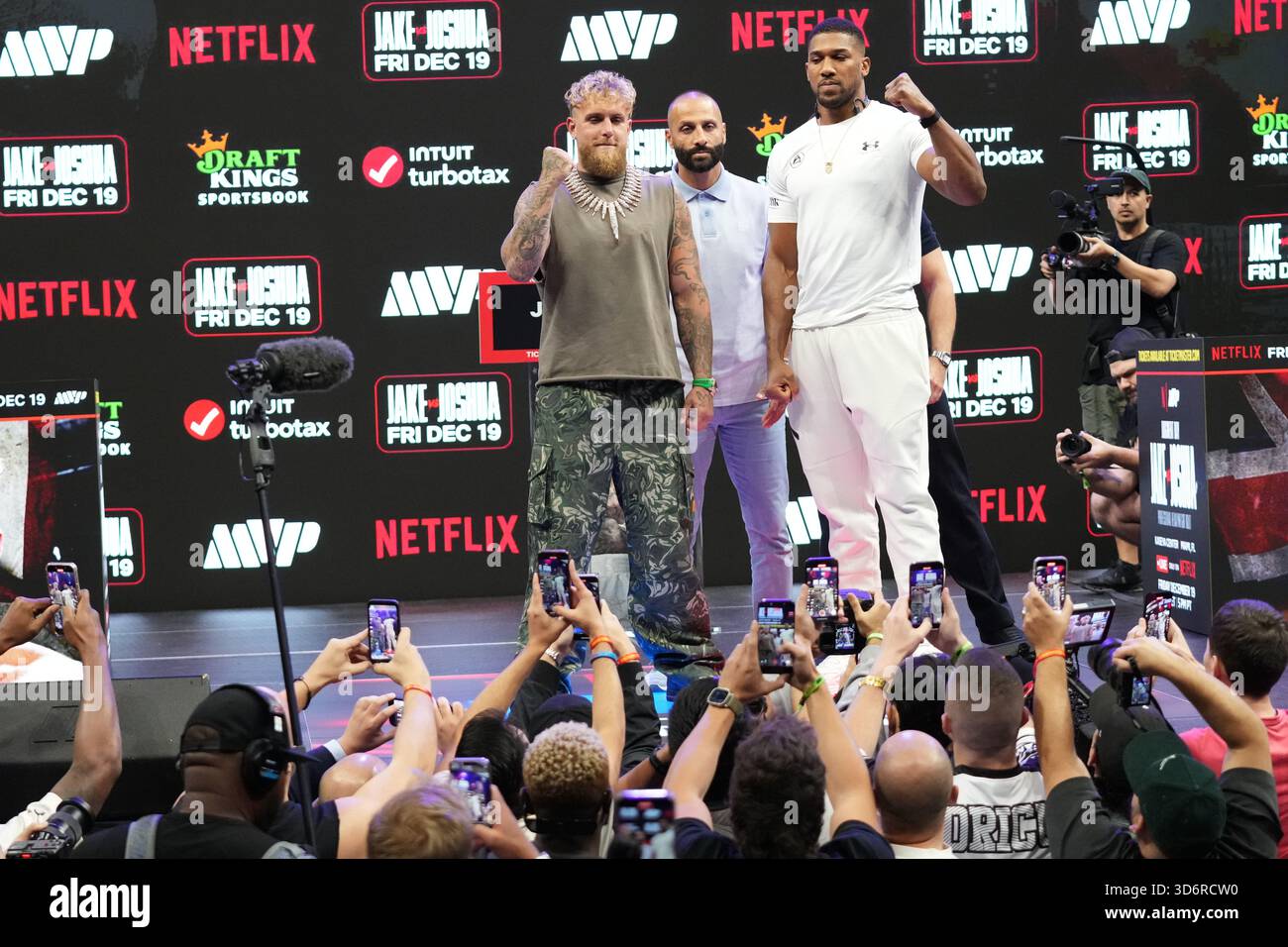 Jake Paul, left, and Anthony Joshua, right, pose during a news ...