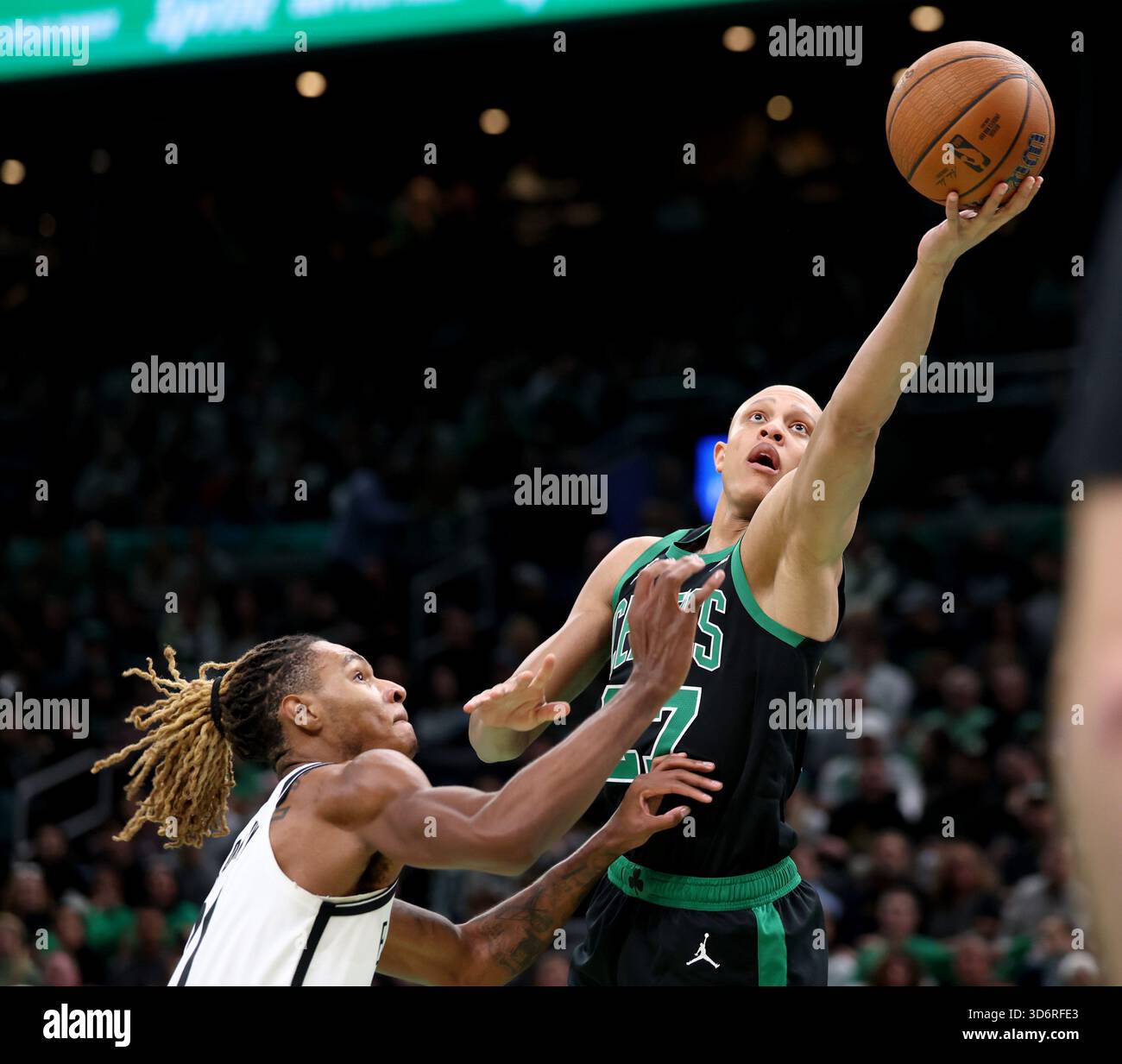 Boston Celtics guard Jordan Walsh, right, lays up the ball next to ...