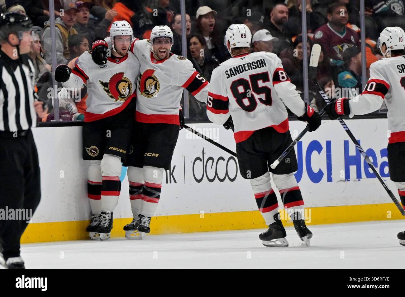 Ottawa Senators right wing Drake Batherson, left, is congratulated by ...