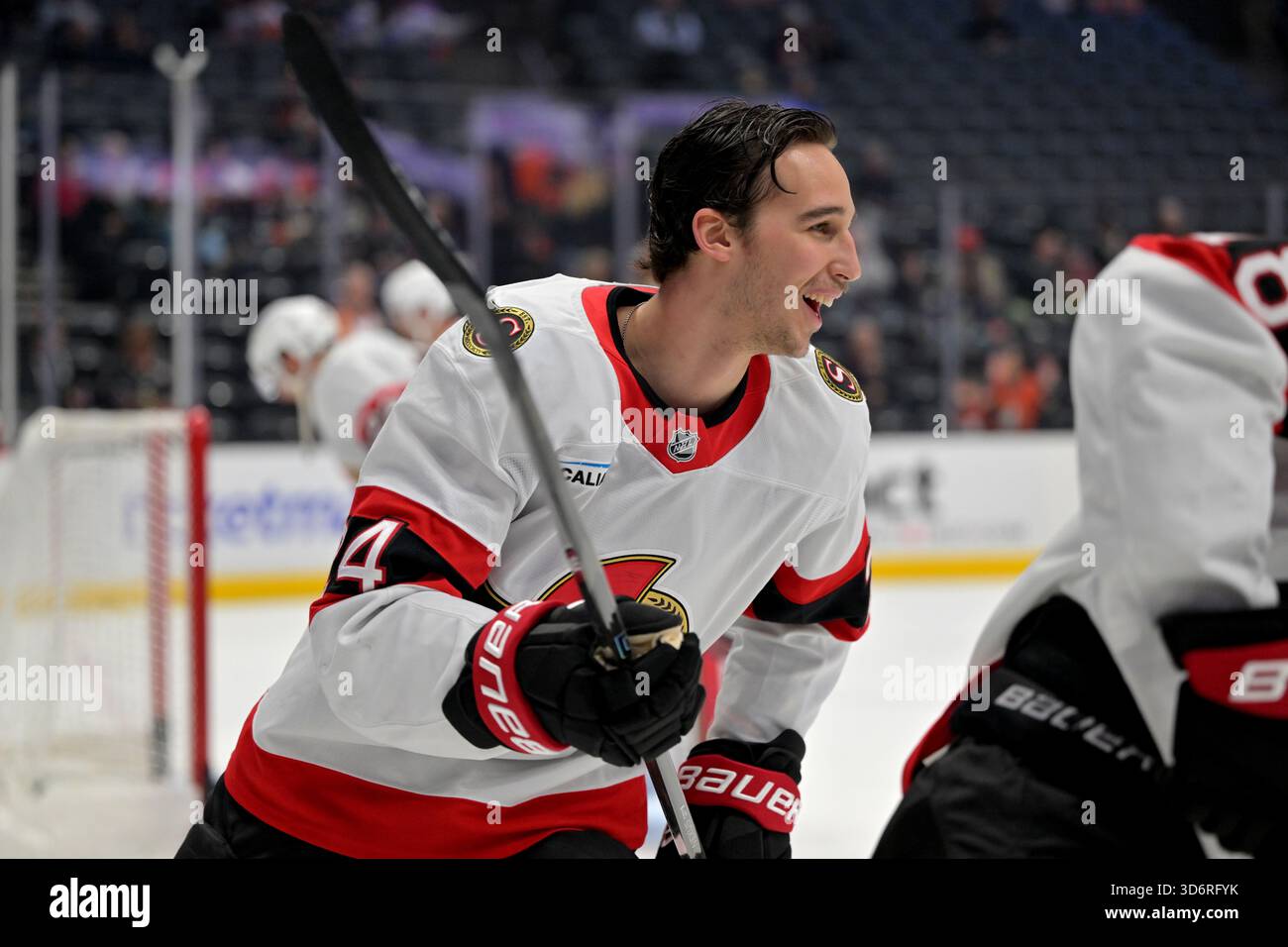 Ottawa Senators center Dylan Cozens warms up prior to an NHL hockey ...