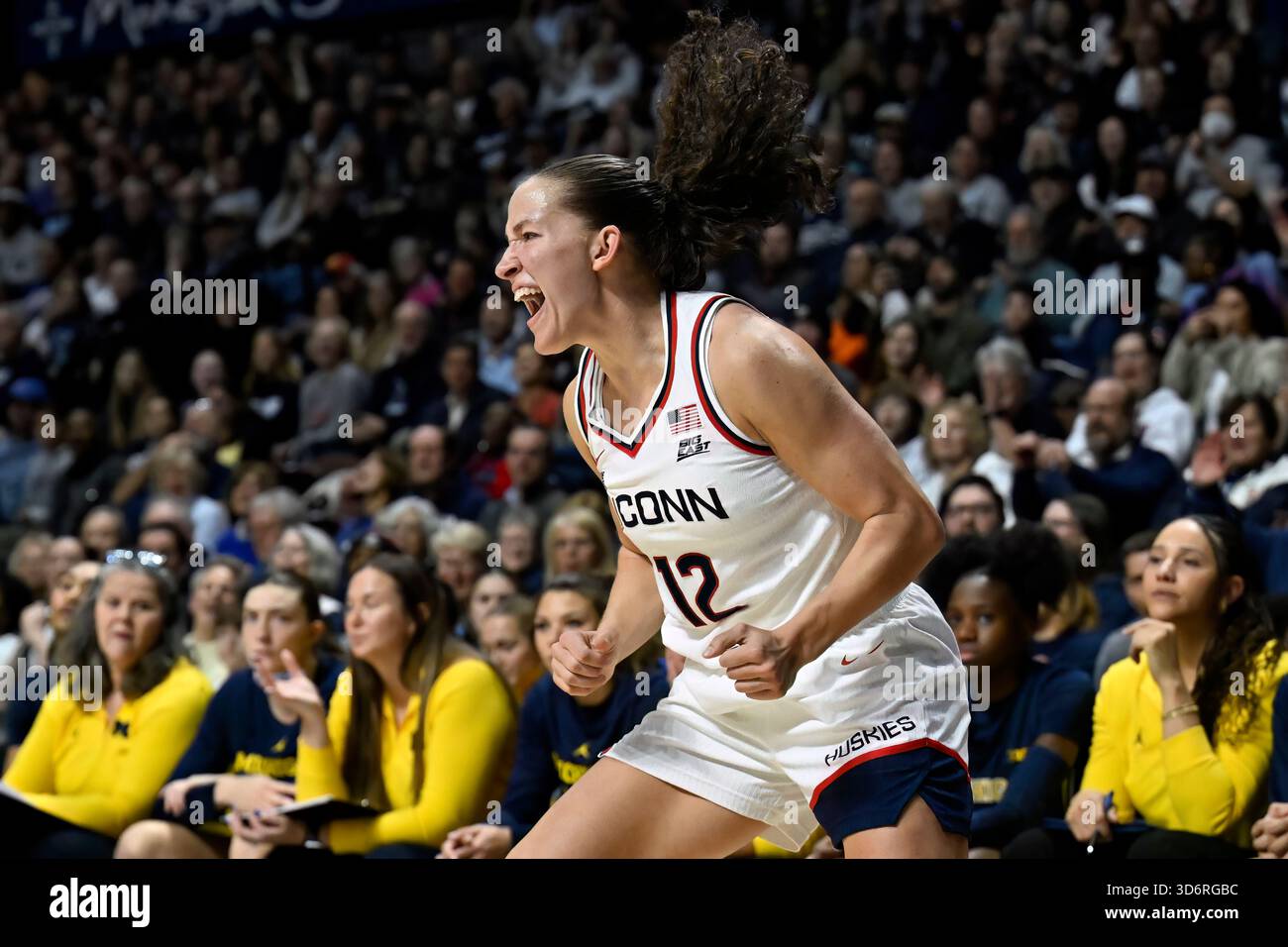 UConn guard Ashlynn Shade (12) reacts to making a basket in the first ...
