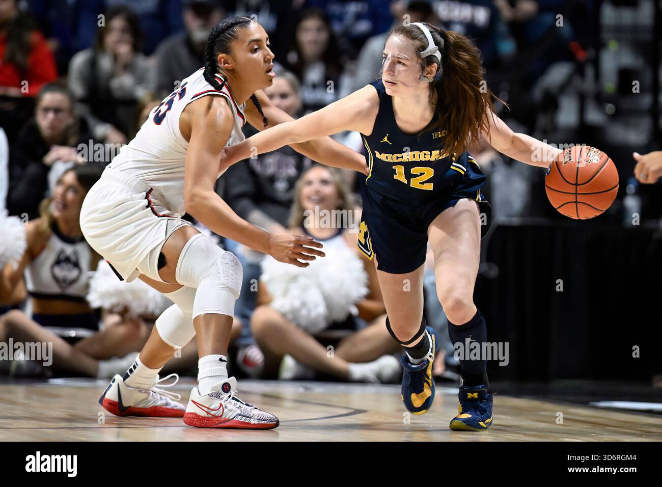Michigan guard Syla Swords (12) is guarded by UConn guard Azzi Fudd in ...